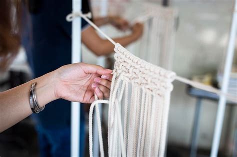 Cropped Hand Of Woman Doing Macrame Premium Photo