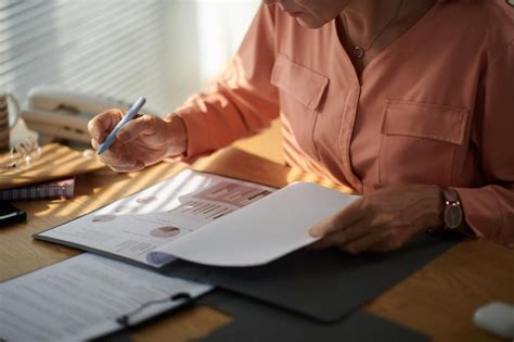 Premium Photo Entrepreneur Analyzing Report Of Marketing Department