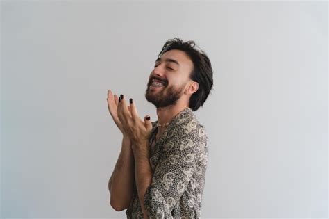 Premium Photo Young Queer Latin Gay Man With A Smile Rejoicing With