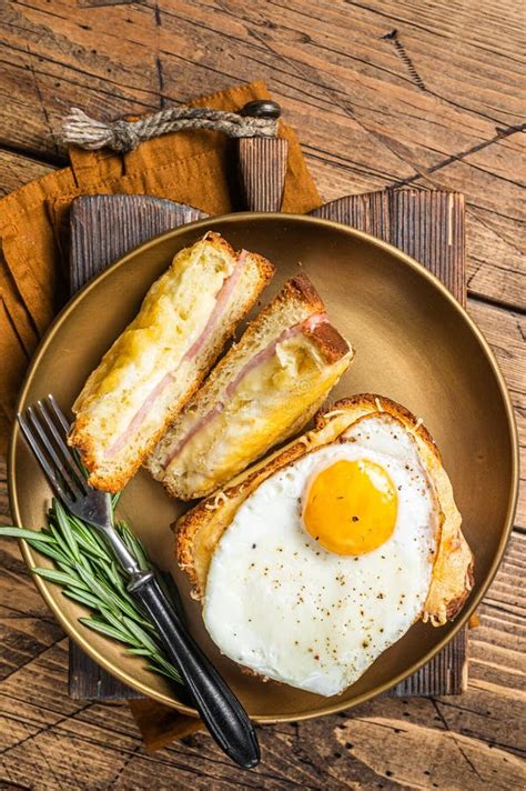 Croque Monsieur And Croque Madame Sandwiches With Sliced Ham Melted Emmental Cheese And Egg
