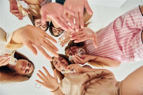 View From Below Group Of Happy Women That Is At A Bachelorette Party