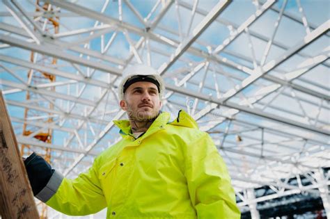 Construction Workers At Work On Modern Building Site Stock Image Image Of Highvisibility