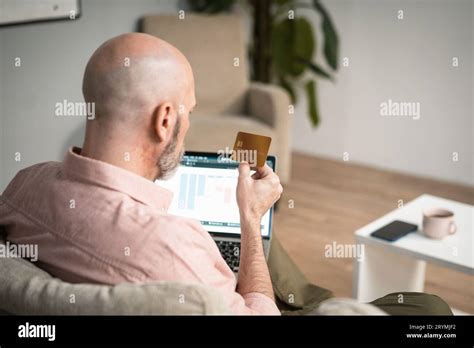 Old Man Make Payment Online Back View Mature Man Holding Credit Card