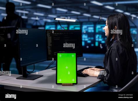 Admin In Data Center Running System Diagnostic Tests Using Green Screen Tablet Woman In Server