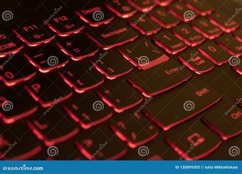 Red Backlit Laptop Keyboard Hacking And Blockchain Concept Stock Image
