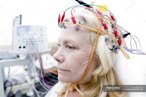 Mature Blonde Woman Undergoing Electroencephalography Monitoring