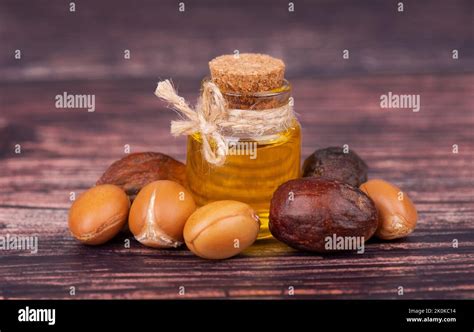 Argan Oil On Wooden Background Argan Nuts And Seeds For Cosmetic And