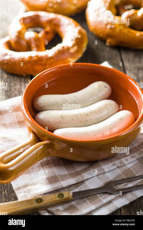 The Bavarian Weisswurst Pretzel And Mustard In Pot With Water Stock