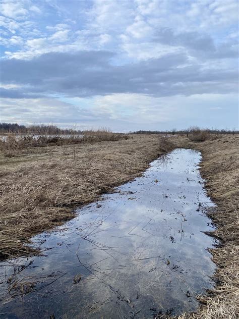 Spring Village Landscape The Sky In The Clouds Dry Grass On The Field