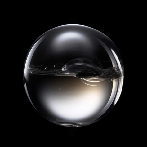 Premium AI Image Transparent Glass Sphere With Water On Black Background D Illustration
