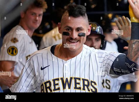Milwaukee Brewers Joey Ortiz High Fives Teammates After Hitting A Two Run Home Run During The