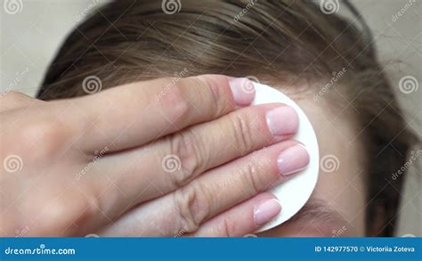 Teenage Girls Apply A Moisturizing Face Cream For Acne Girl Rubs Her