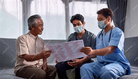 A Healthcare Worker Showing A Patient A Pamphlet That Explains The
