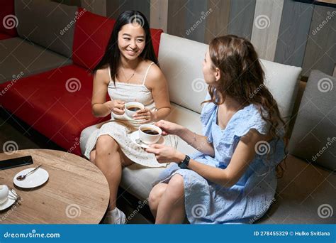 Communication Of Cute Lady In Lobby Of Hotel For Coffee Stock Image