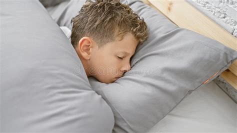 Blond Boy Lying On Bed Sleeping At Bedroom Stock Image Image Of