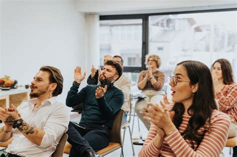 Applause Fills The Classroom As Business Professionals Commend Their