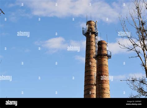 Two Tall Brick Chimneys Above Abandoned Boiler Building For Venting