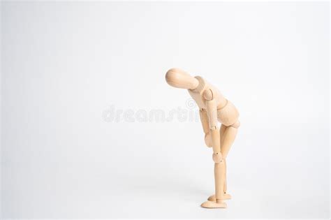 Wooden Puppet Is Having Knee Ache A Doll Is Touching Its Leg Stock