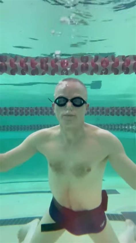 Bubbling Underwater In Speedos And Goggles