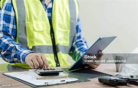 Revenue Calculation Engineer Construction Costs On The Desk Concept Of