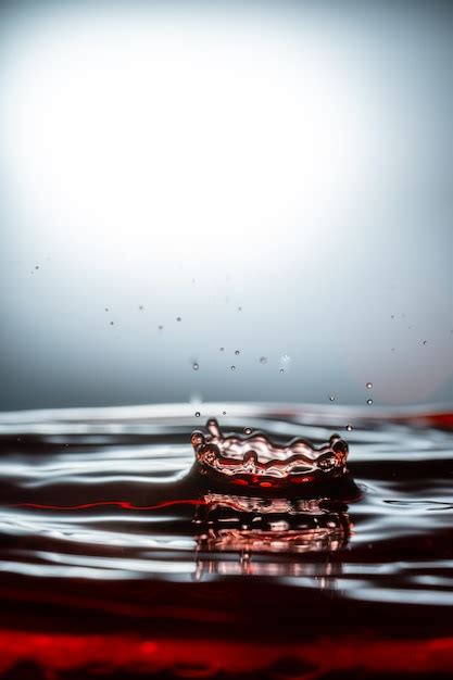 Premium Photo View Of Red Water Splashed With White Background
