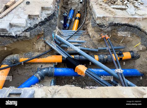 Construction Site With Excavated Trenches With Multi Colored Plastic Pipes Pipeline Crossing