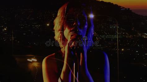 Female Singer Performing Under Blue Orange Lights For Music Shoot