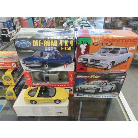 5 Assorted Car Model Kits And Diecast Car