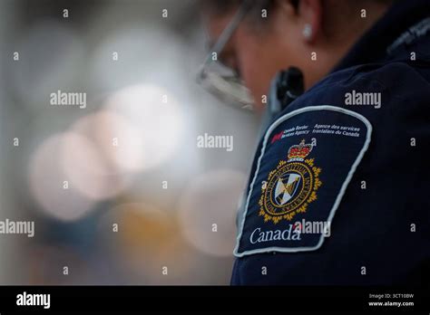 A Canada Border Services Agency Patch Is Seen On The Uniform Of A Cbsa