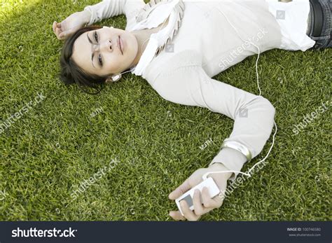 Woman Laying Down On Grass Over 5555 Royalty Free Licensable Stock