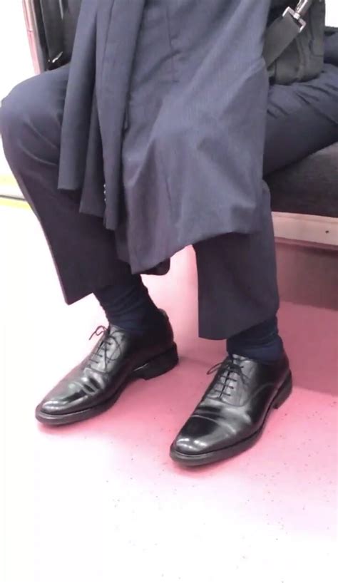 Japanese Suit Guy On Train
