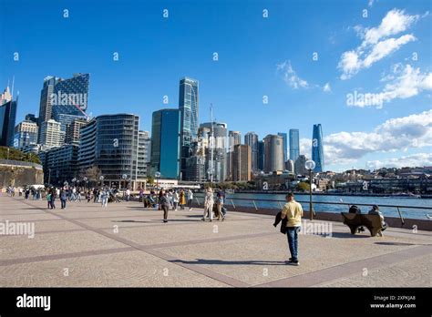 Sydney Circular Quay And Sydney Harbour With Tourists Walking Beside