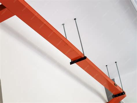 Premium Photo Over Head Orange Color Cable Tray Or Trunking Mount On Concrete Ceiling