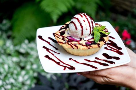 Premium Photo Hands Hold Dessert Home Made Ice Cream With Fresh Mint