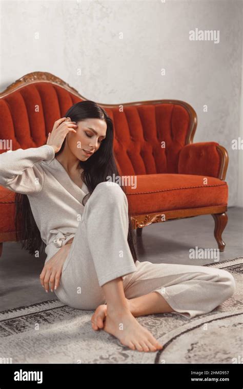 Young Brunette Barefoot Woman In Warm Cashmere Clothes At Home Home