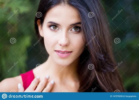 Close Up Outdoor Portrait Of Young Beautiful Brunette Woman With Green