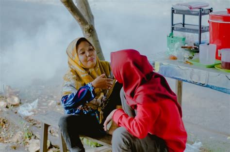 Premium Photo Full Length Of Girls Sitting Outdoors