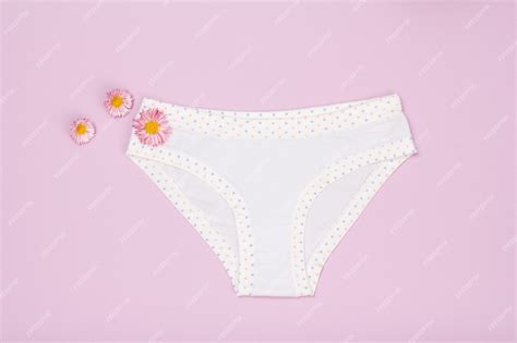 Premium Photo White Cotton Panties With Flower Buds On Pink