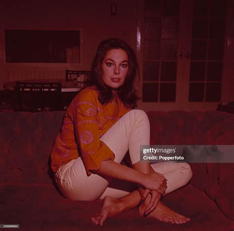 English Actress Tracy Reed Posed Wearing An Orange Top And White