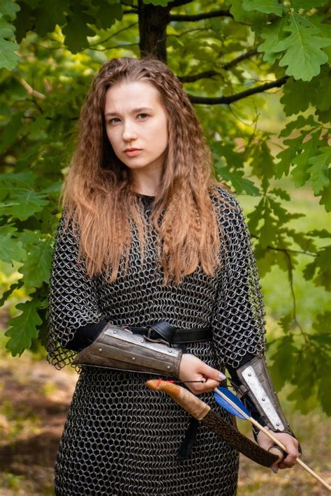 Medieval Warrior Woman In Chain Mail And Bracers With A Bow In Her