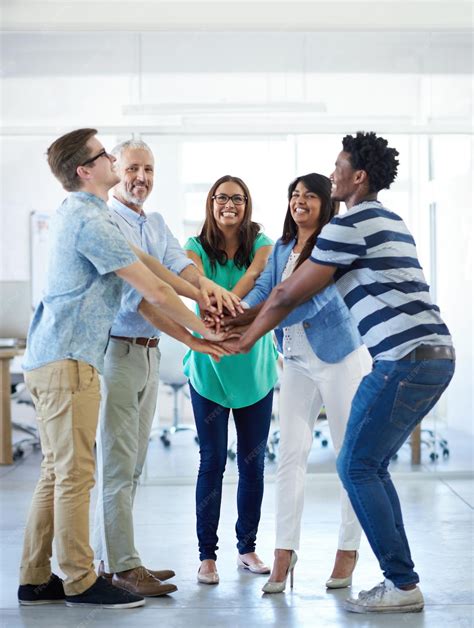 Premium Photo On Three Cropped Shot Of A Creative Business Team In A
