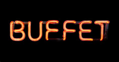 Premium Photo An Isolated Neon Sign For A Restaurant Buffet On A Black Background
