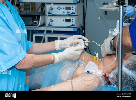Anesthesiologists Administer General Anesthesia To A Patient On The Operating Table Surgery