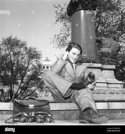 Fun In The 1940s A Young Man With Roller Skates It Looks As If He Is