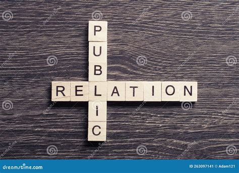 Public Relation Crossword On Office Table Collected Of Wooden Cubes
