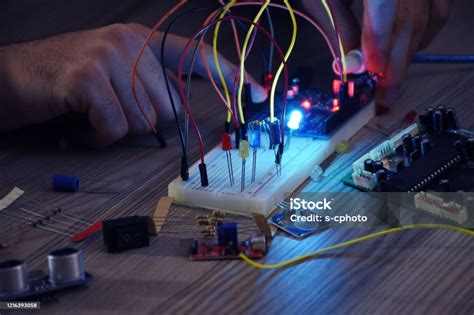 an engineer working on opensource hardware and software project breadboard electronic module