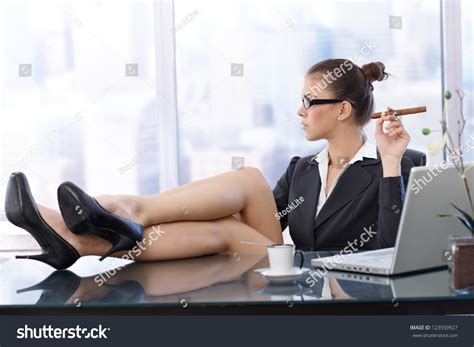 Woman Feet Up On Desk