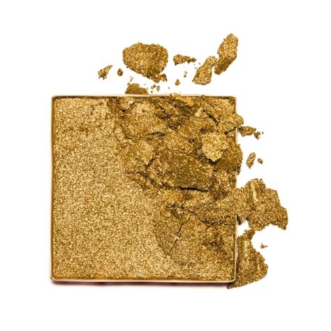 Premium Photo A Sample Of Golden Eye Shadow Cosmetic Product Isolated On White Background