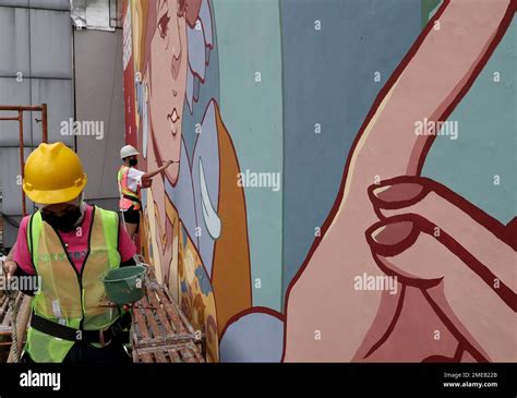 Indonesian Artists Make Finishing Touches To A Large Gender Equality