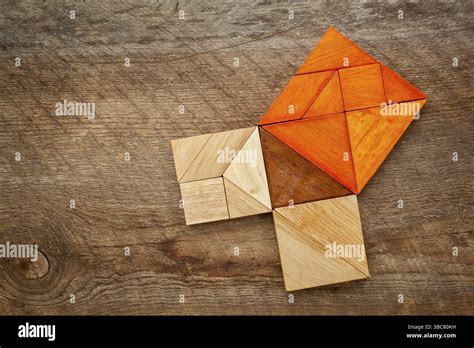 Pythagorean Theorem Illustrated With Wooden Pieces Of Tangram A